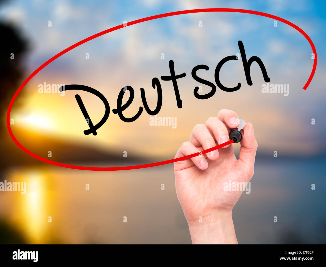 Man Hand writing Deutsh (German in German) with black marker on visual ...