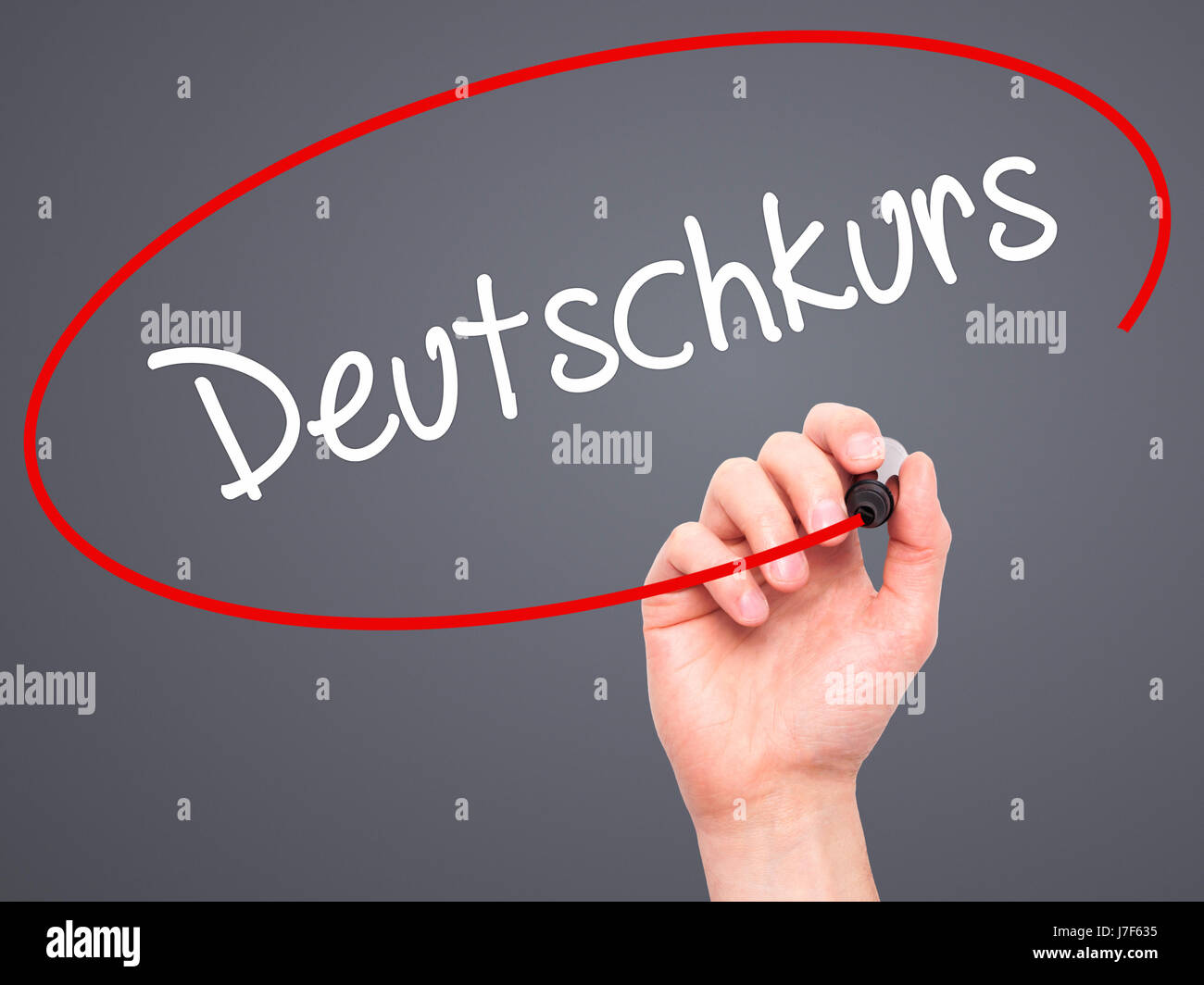 Man Hand writing Deutschkurs (German Course in German) with black ...