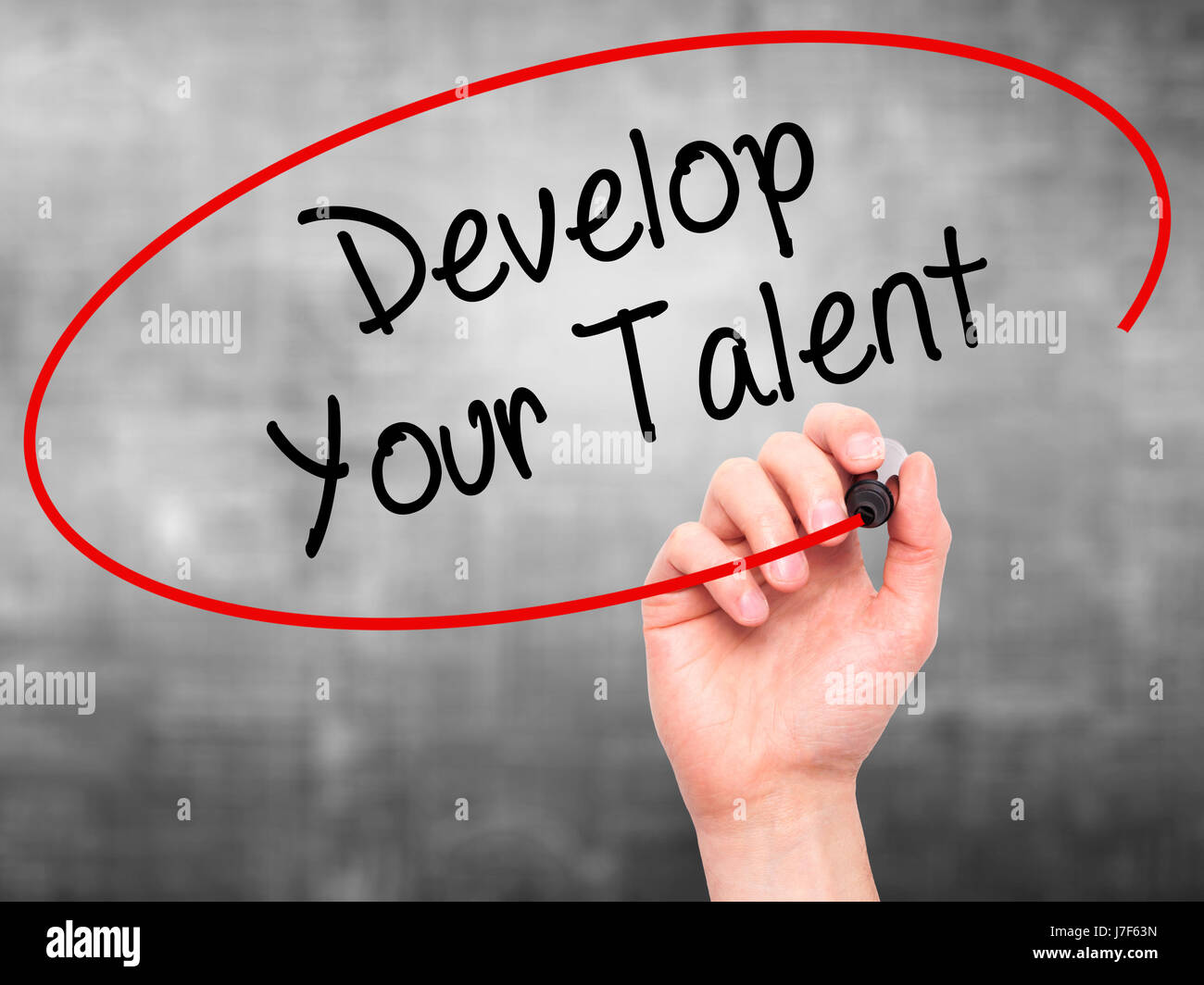 Man Hand writing Develop Your Talent with black marker on visual screen ...