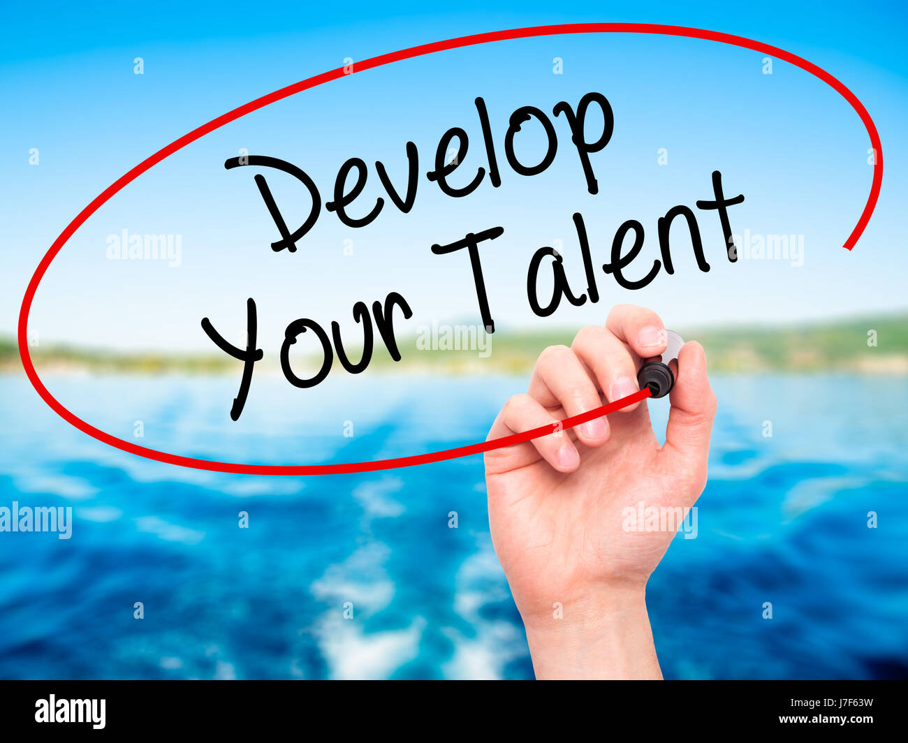 Man Hand writing Develop Your Talent with black marker on visual screen ...