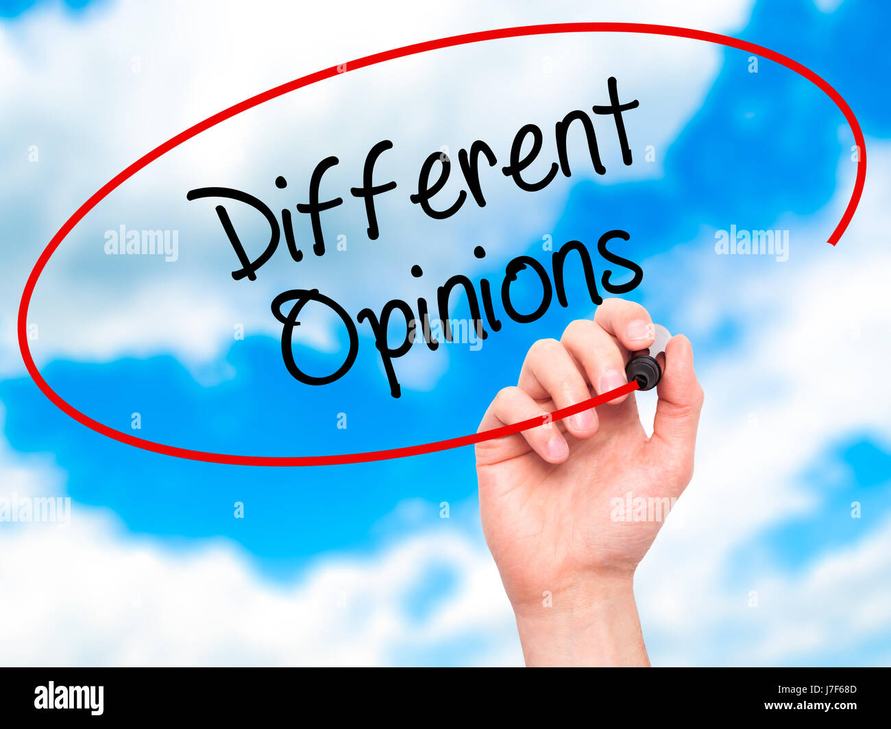 Man Hand writing Different Opinions with black marker on visual screen ...