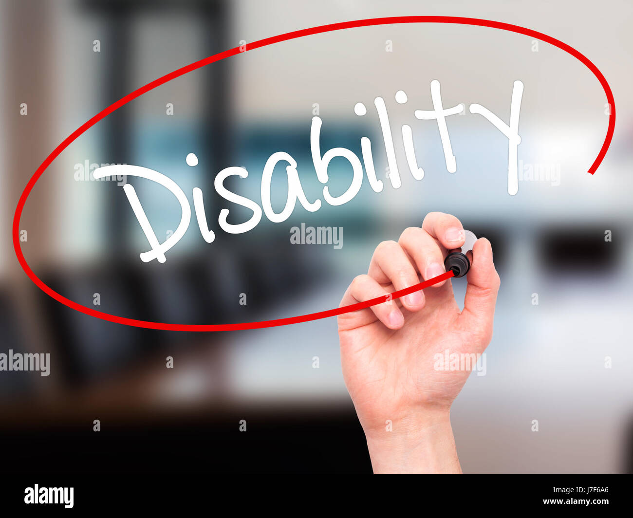 Man Hand writing Disability with black marker on visual screen ...