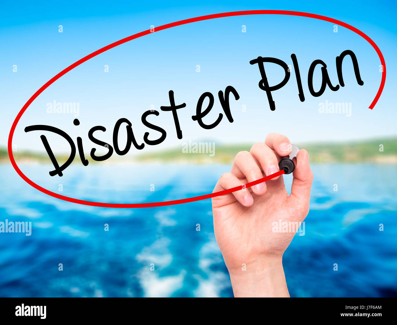 Man Hand writing Disaster Plan with black marker on visual screen ...