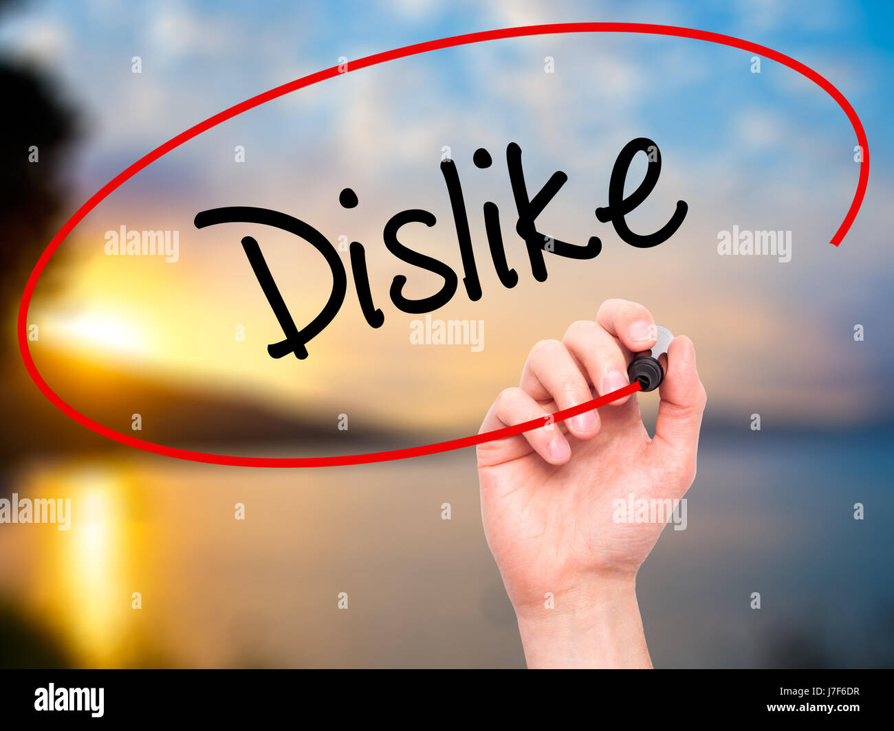 Man Hand writing Dislike with black marker on visual screen. Isolated ...