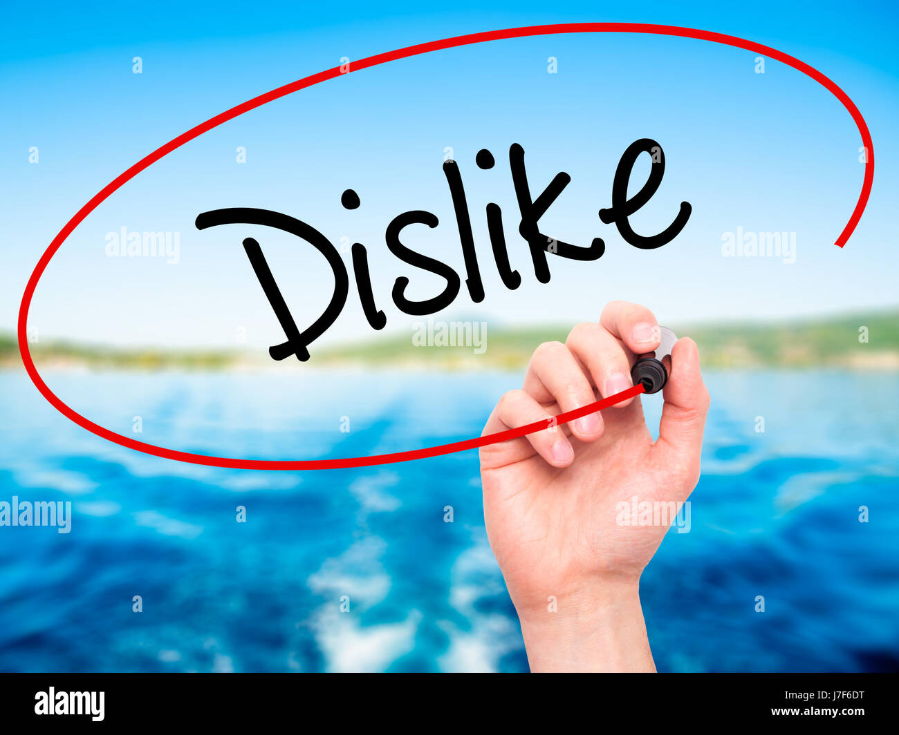 Man Hand writing Dislike with black marker on visual screen. Isolated ...