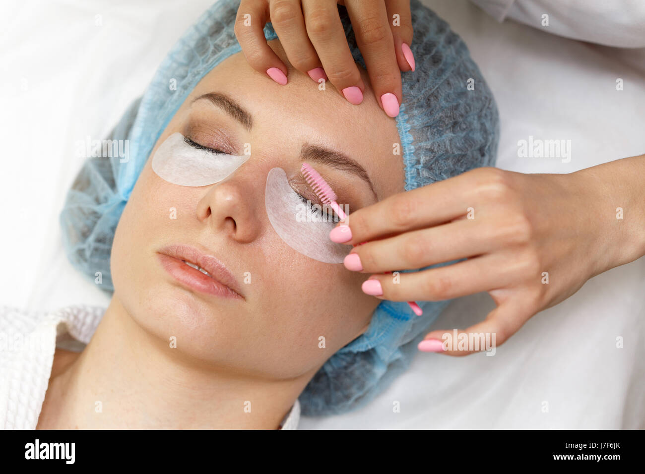 Beauty salon. Preparation of eyelashes of the lower eyelid before the ...