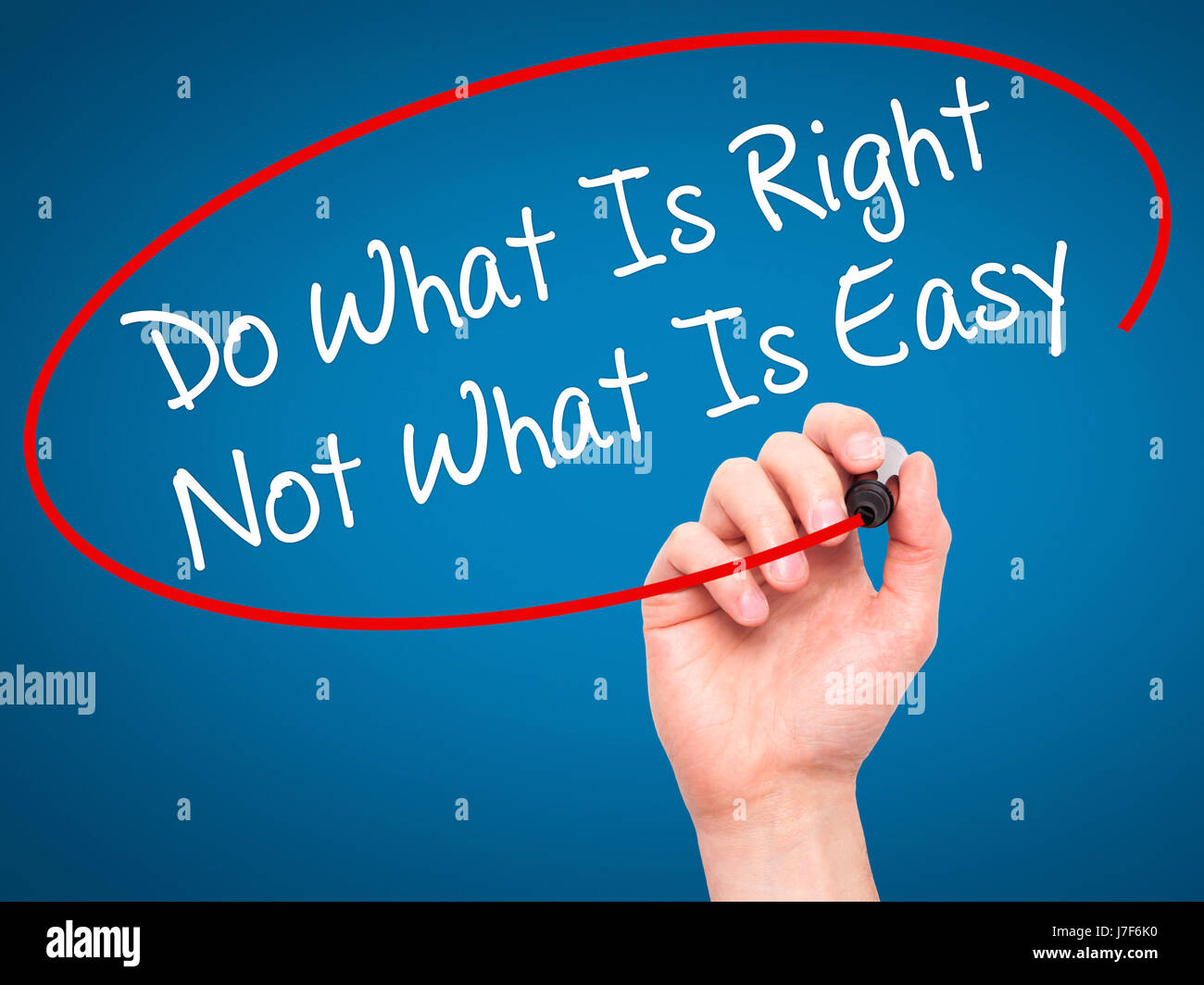 Man Hand writing Do What Is Right Not What Is Easy with black marker on ...