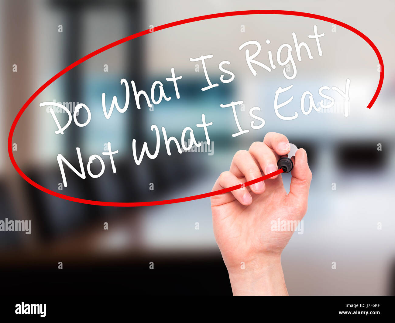 Man Hand writing Do What Is Right Not What Is Easy with black marker on ...