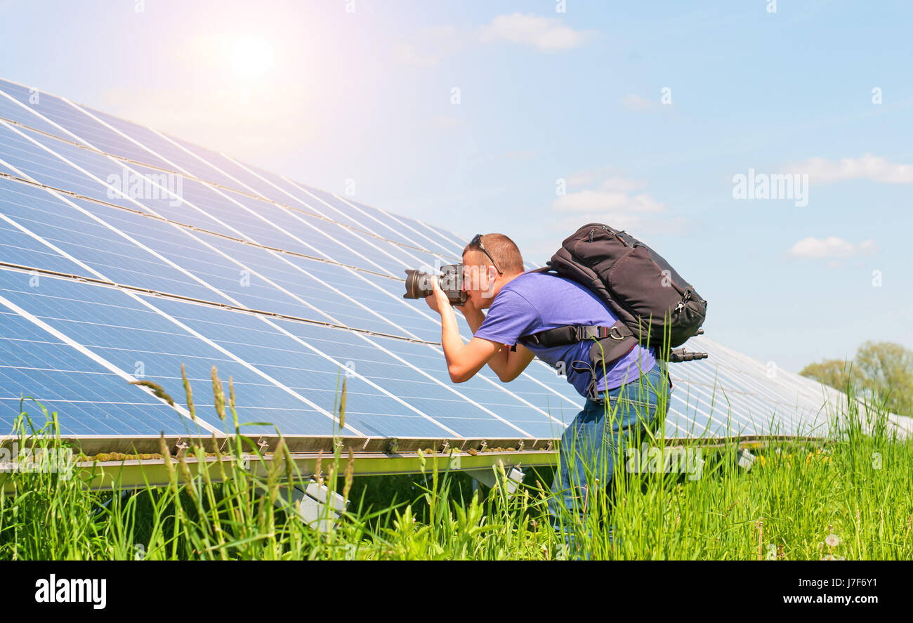 photographer takes pictures of solar panels Stock Photo - Alamy