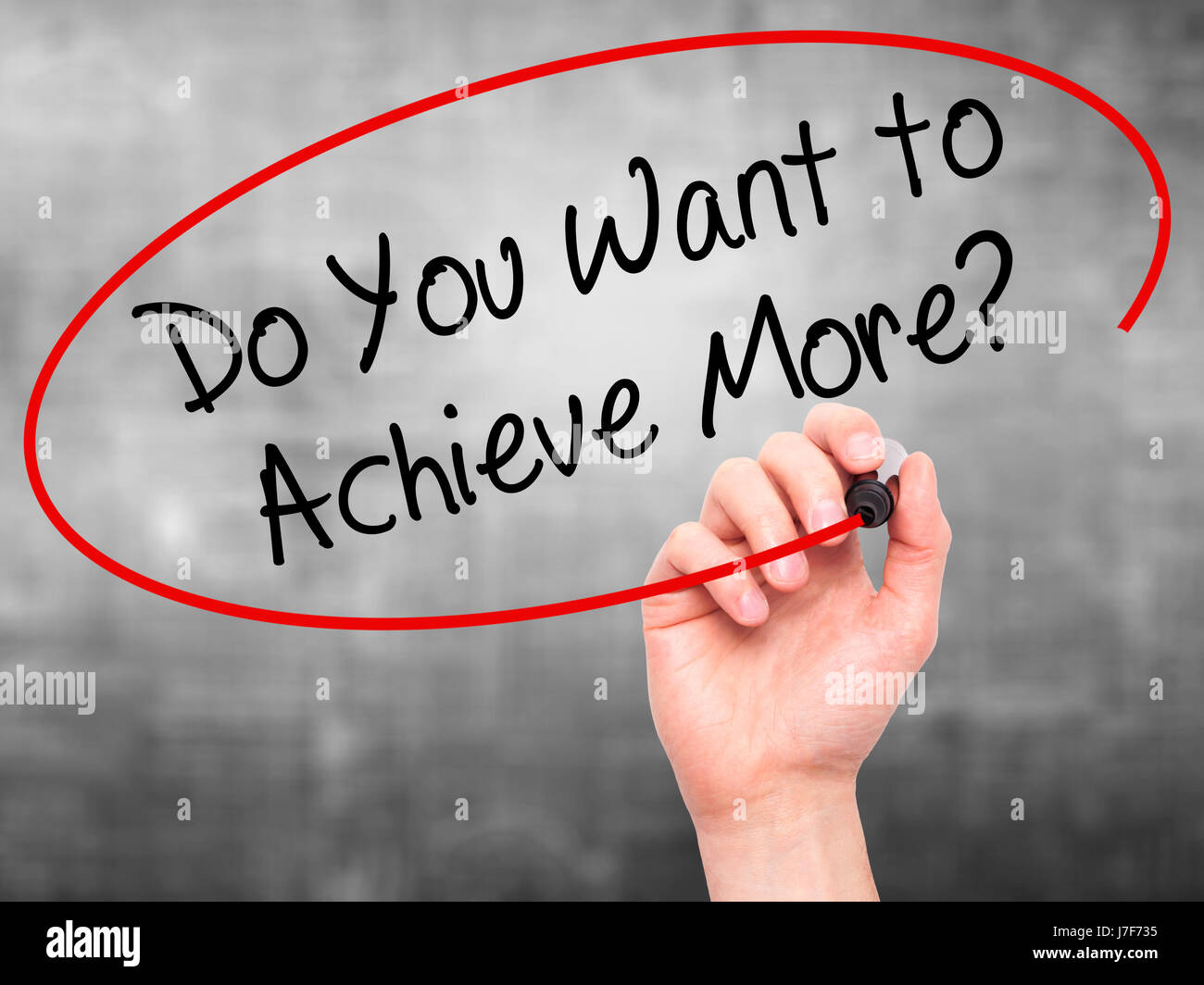 Man Hand writing Do You Want to Achieve More? with black marker on ...