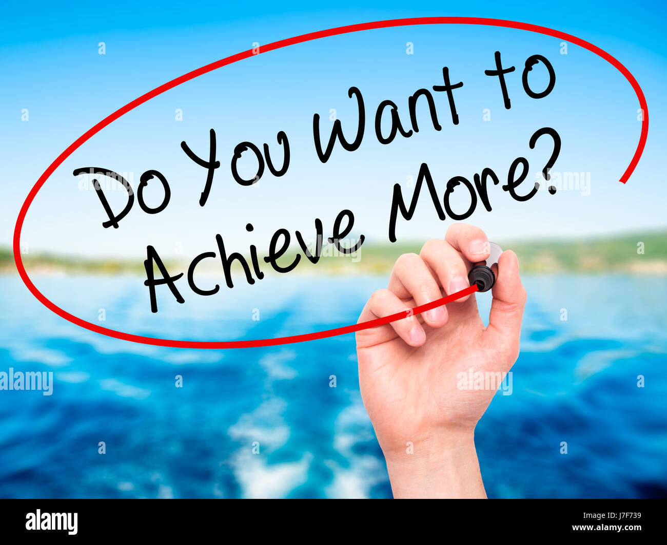 Man Hand writing Do You Want to Achieve More? with black marker on ...