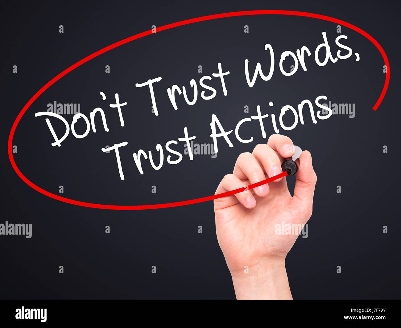 Man Hand writing Don't Trust Words, Trust Actions with black marker on ...