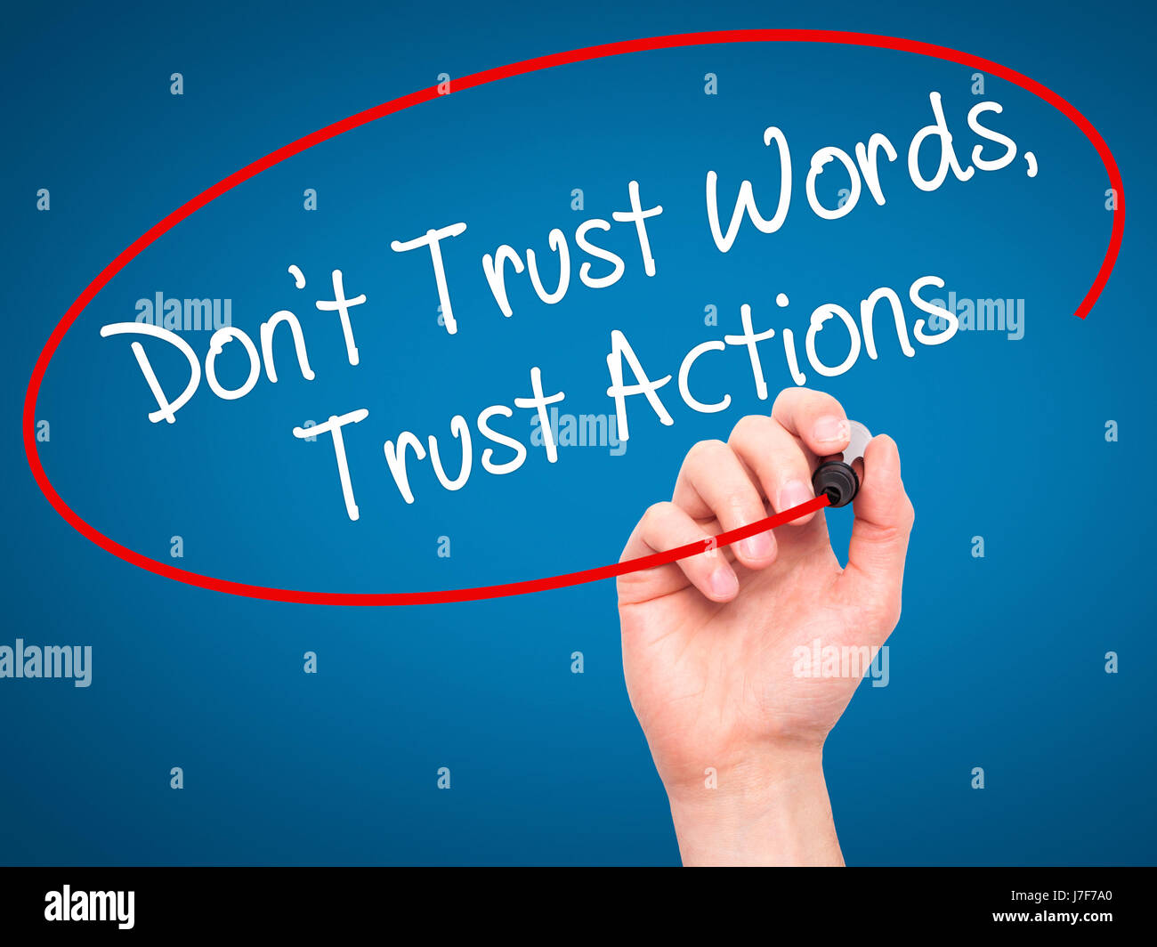Man Hand writing Don't Trust Words, Trust Actions with black marker on ...