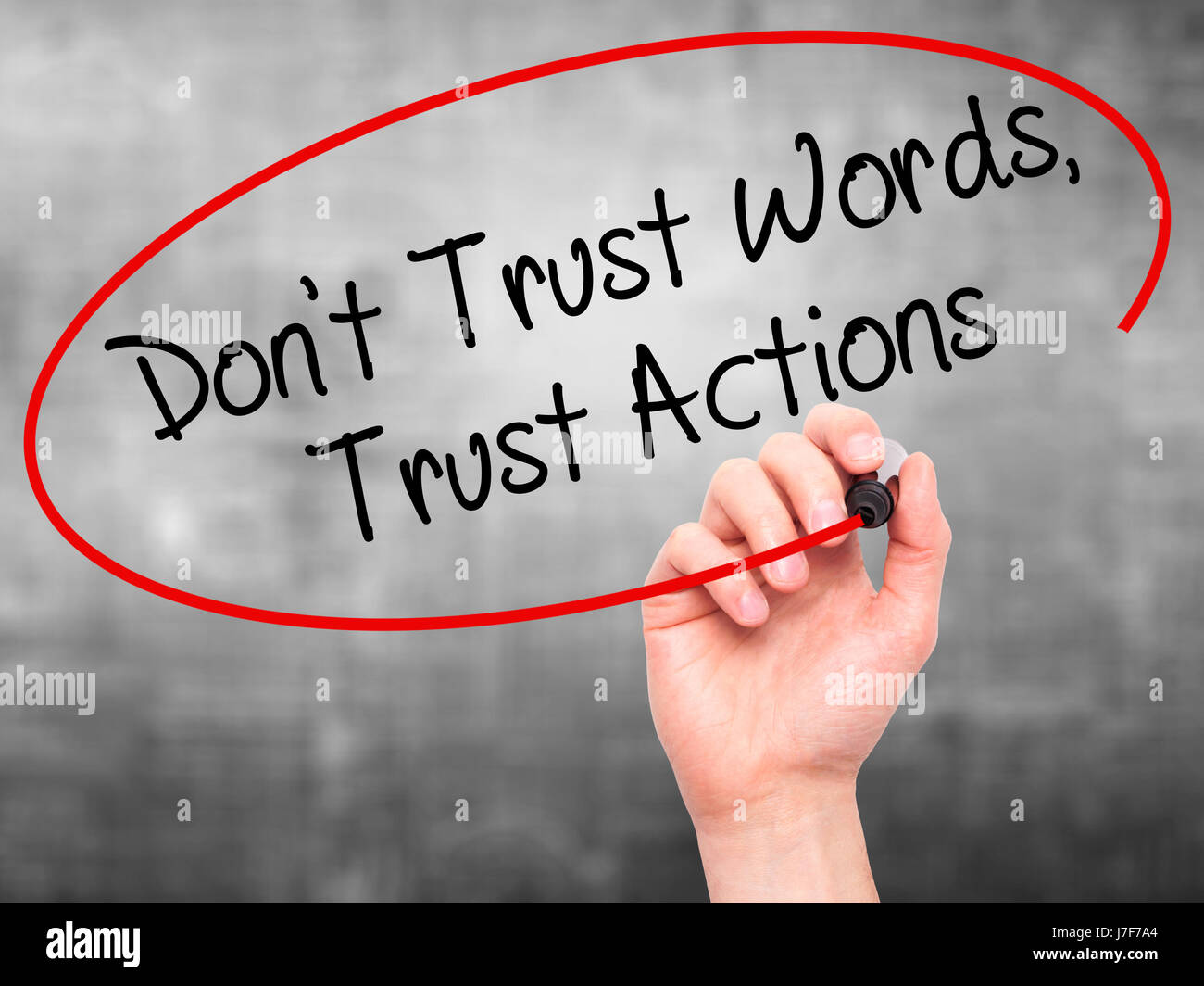 Man Hand writing Don't Trust Words, Trust Actions with black marker on ...