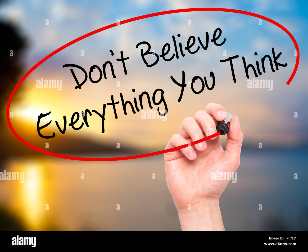 Man Hand writing Don't Believe Everything You Think with black marker ...