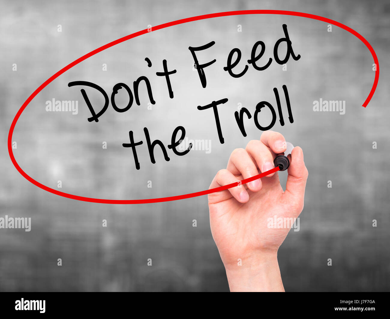 Man Hand writing Don't Feed the Troll with black marker on visual ...