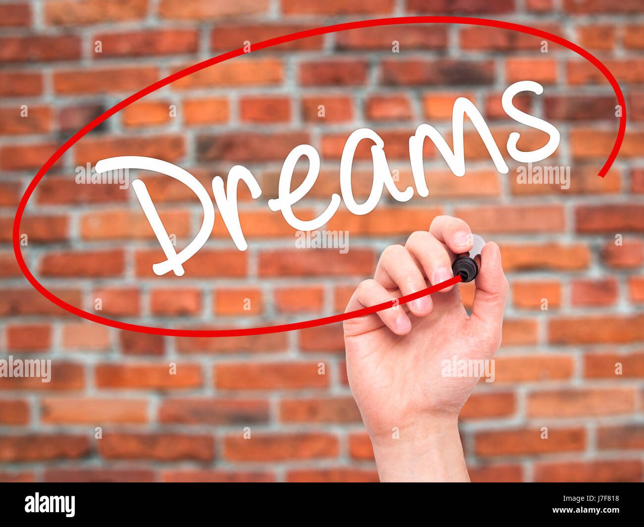 Man Hand writing Dreams with black marker on visual screen. Isolated on ...