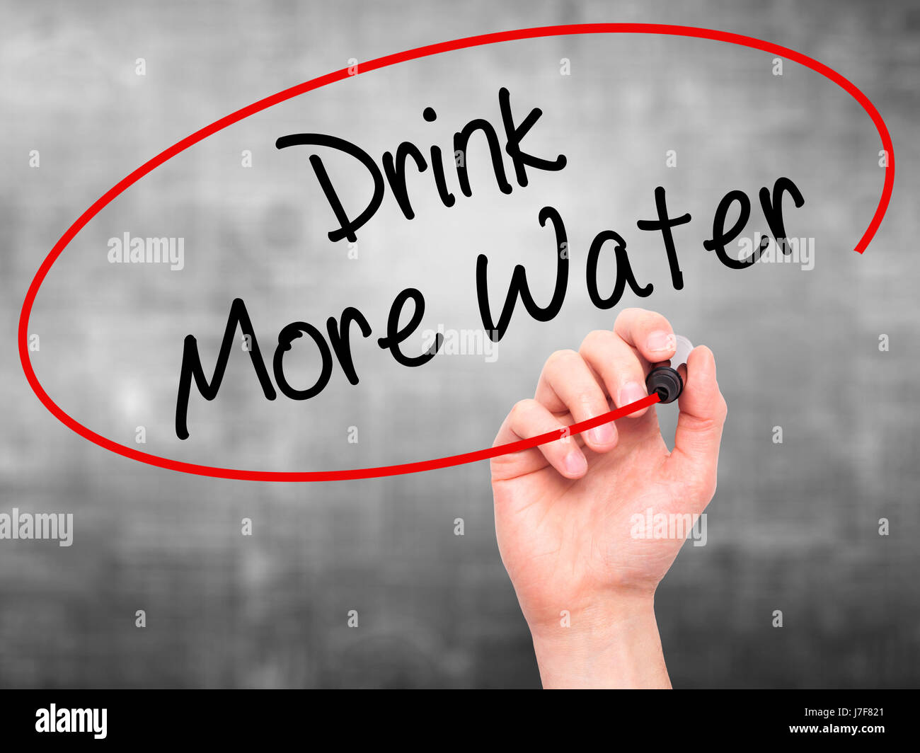 Man Hand writing Drink More Water with black marker on visual screen ...