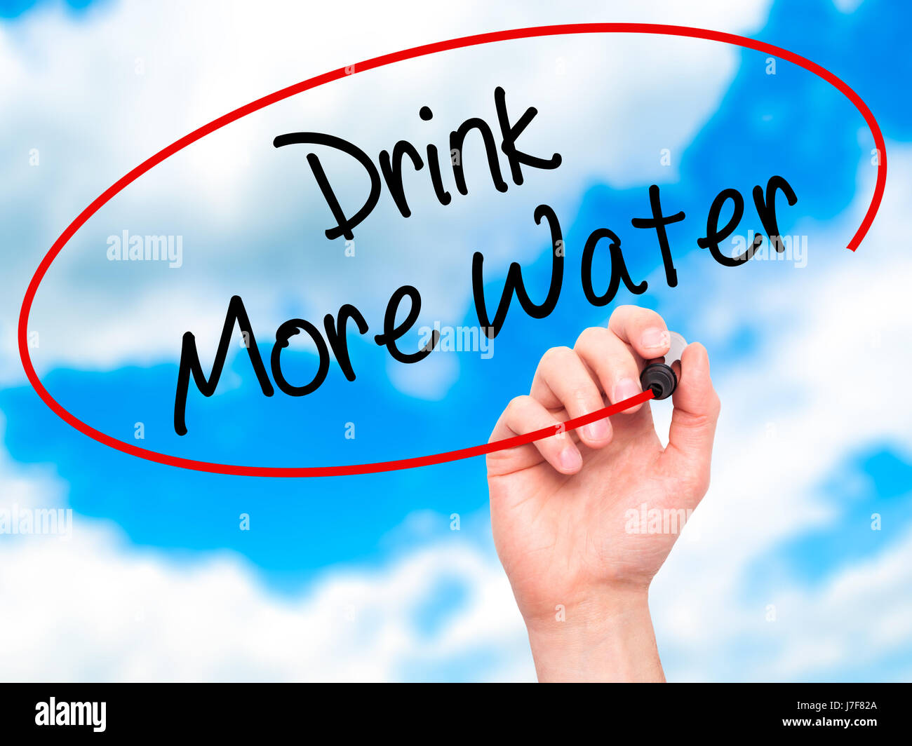 Man Hand writing Drink More Water with black marker on visual screen ...