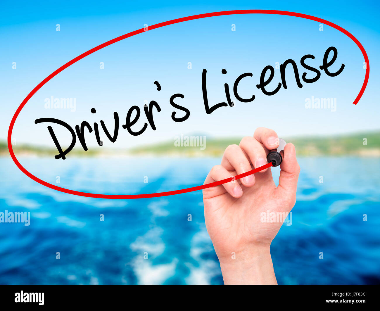 Man Hand writing Drivers License with black marker on visual screen ...