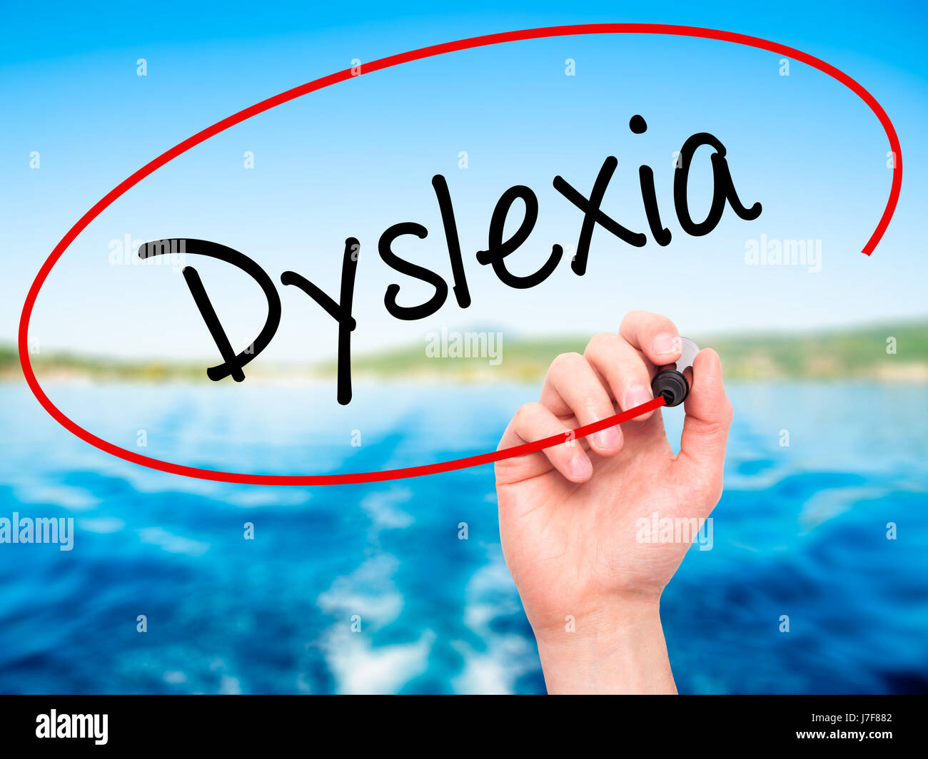 Man Hand writing Dyslexia with black marker on visual screen. Isolated ...