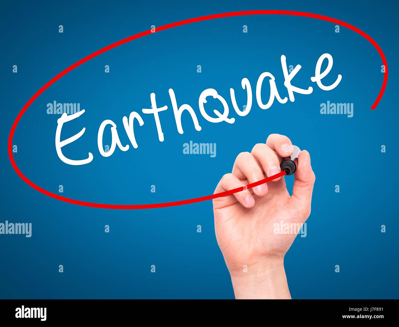 Man Hand writing Earthquake with black marker on visual screen ...