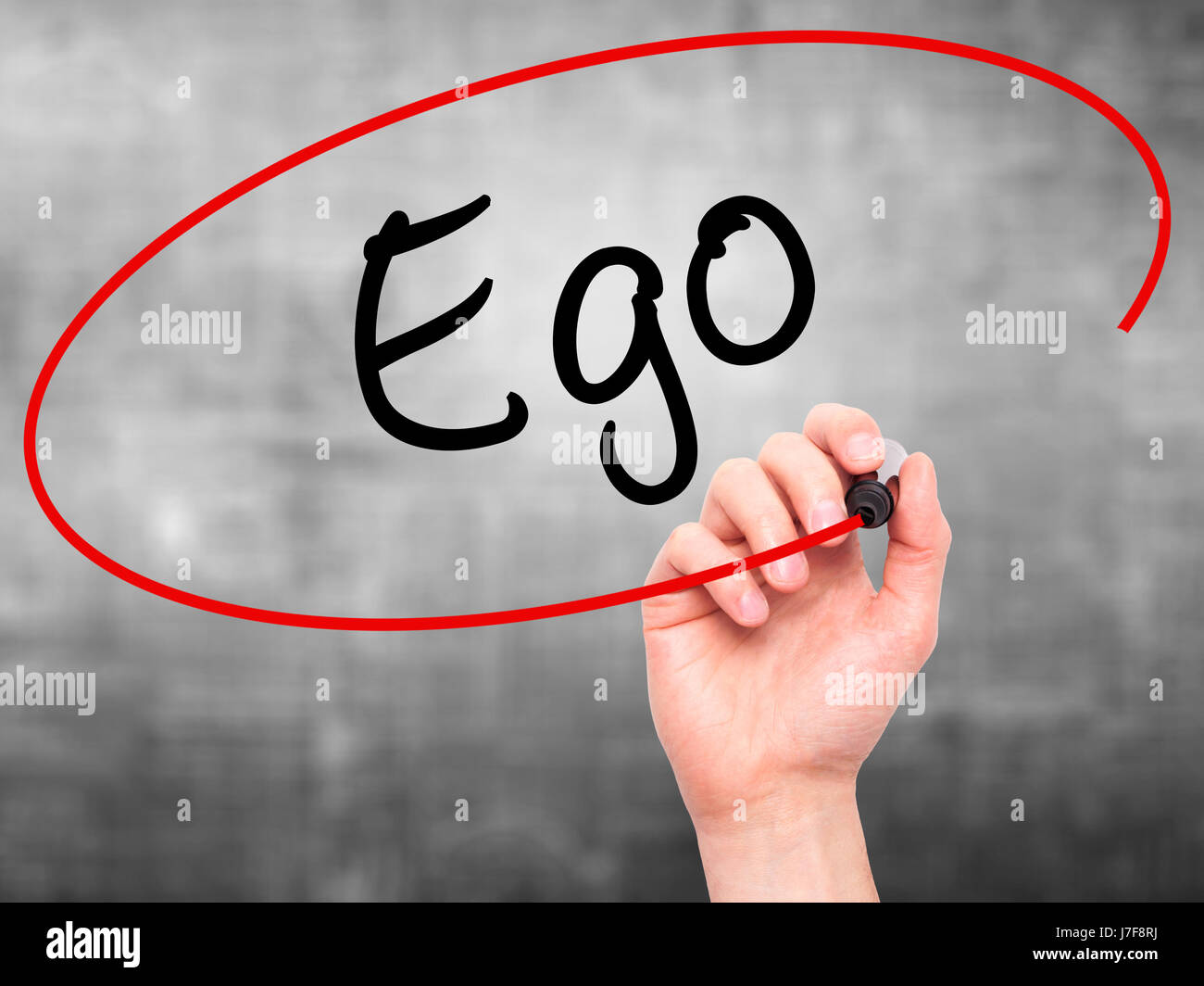 Man Hand writing Ego with black marker on visual screen. Isolated on ...