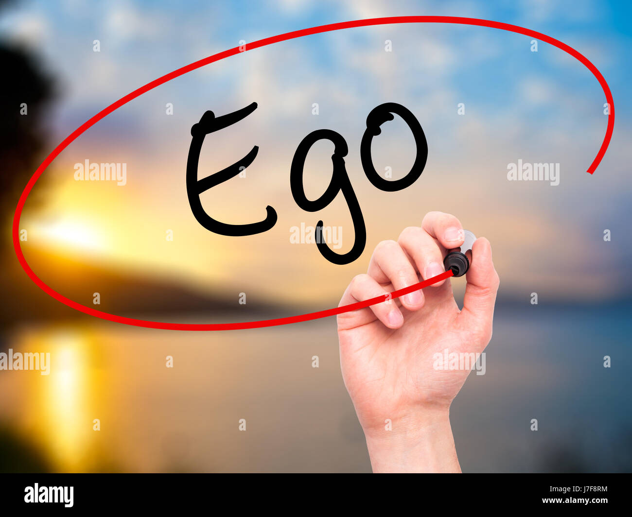 Man Hand writing Ego with black marker on visual screen. Isolated on ...
