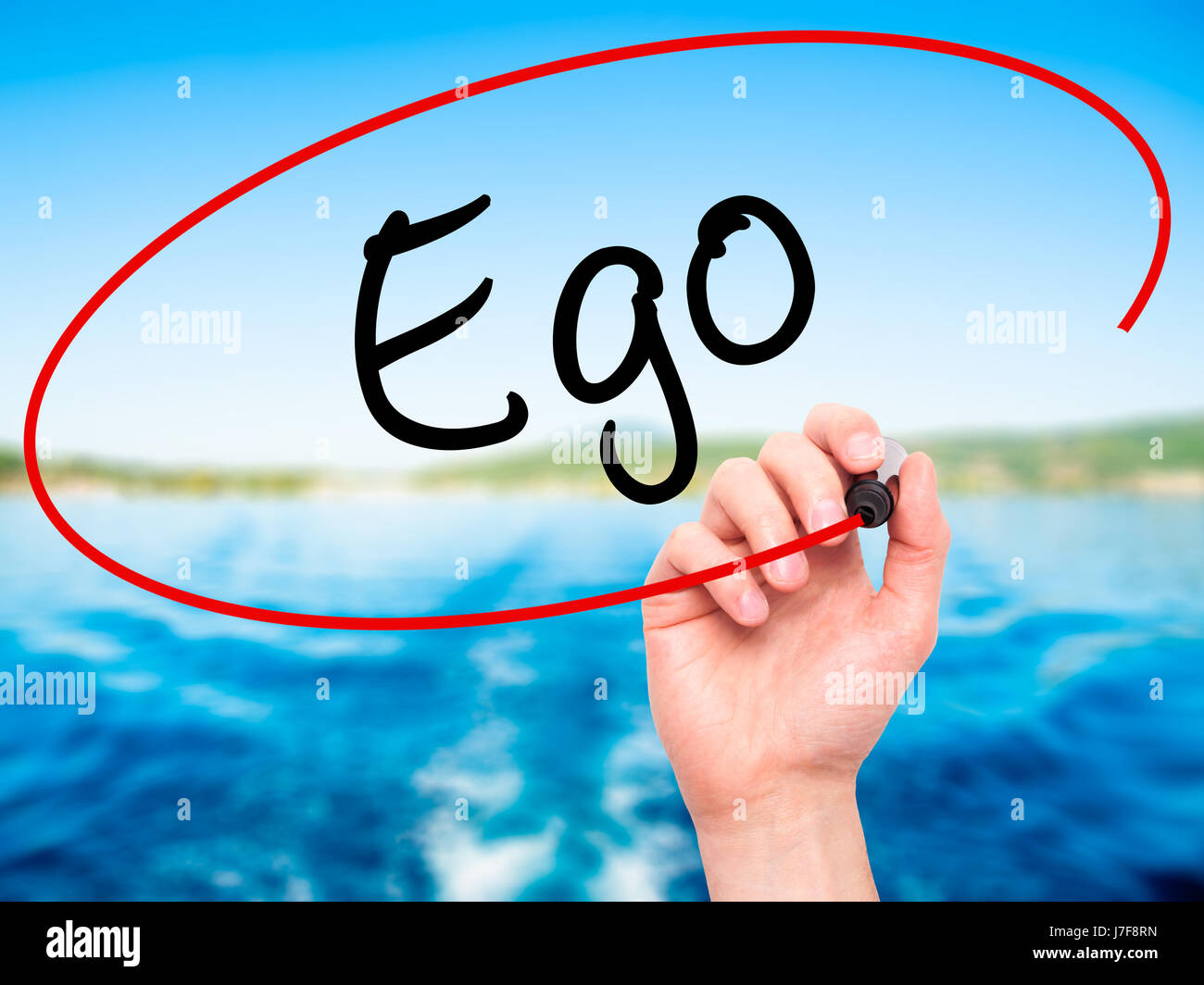 Man Hand writing Ego with black marker on visual screen. Isolated on ...