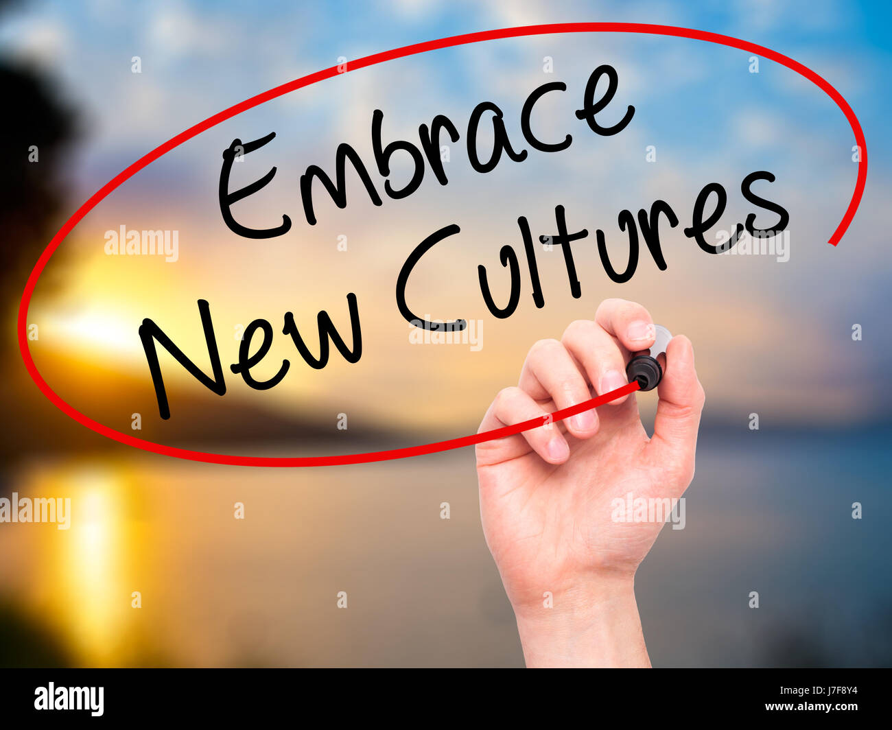 Man Hand writing Embrace New Cultures with black marker on visual ...