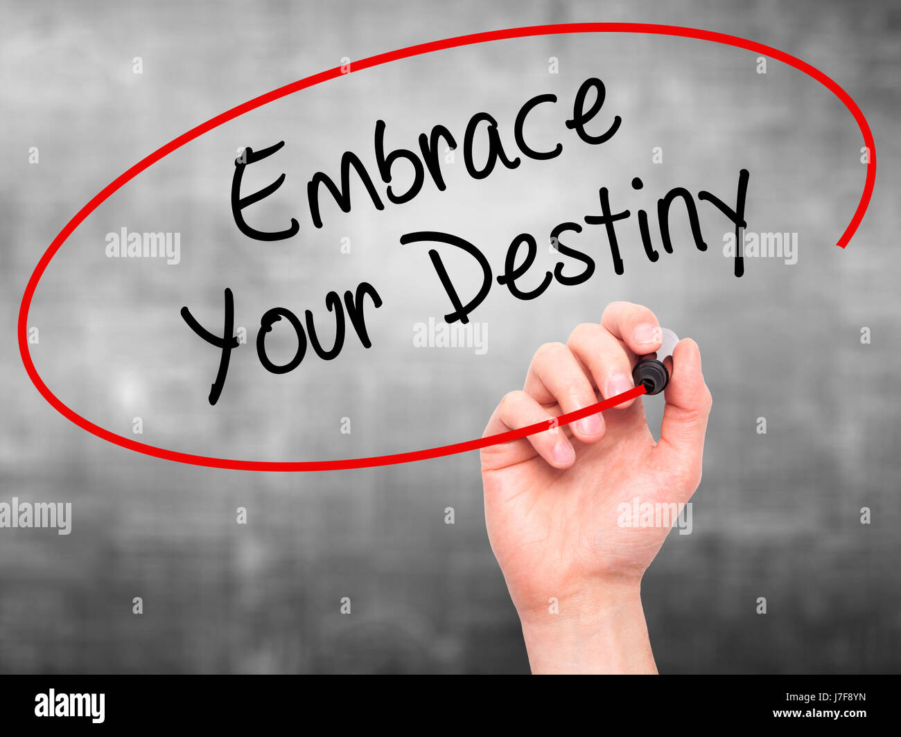 Man Hand writing Embrace Your Destiny with black marker on visual ...