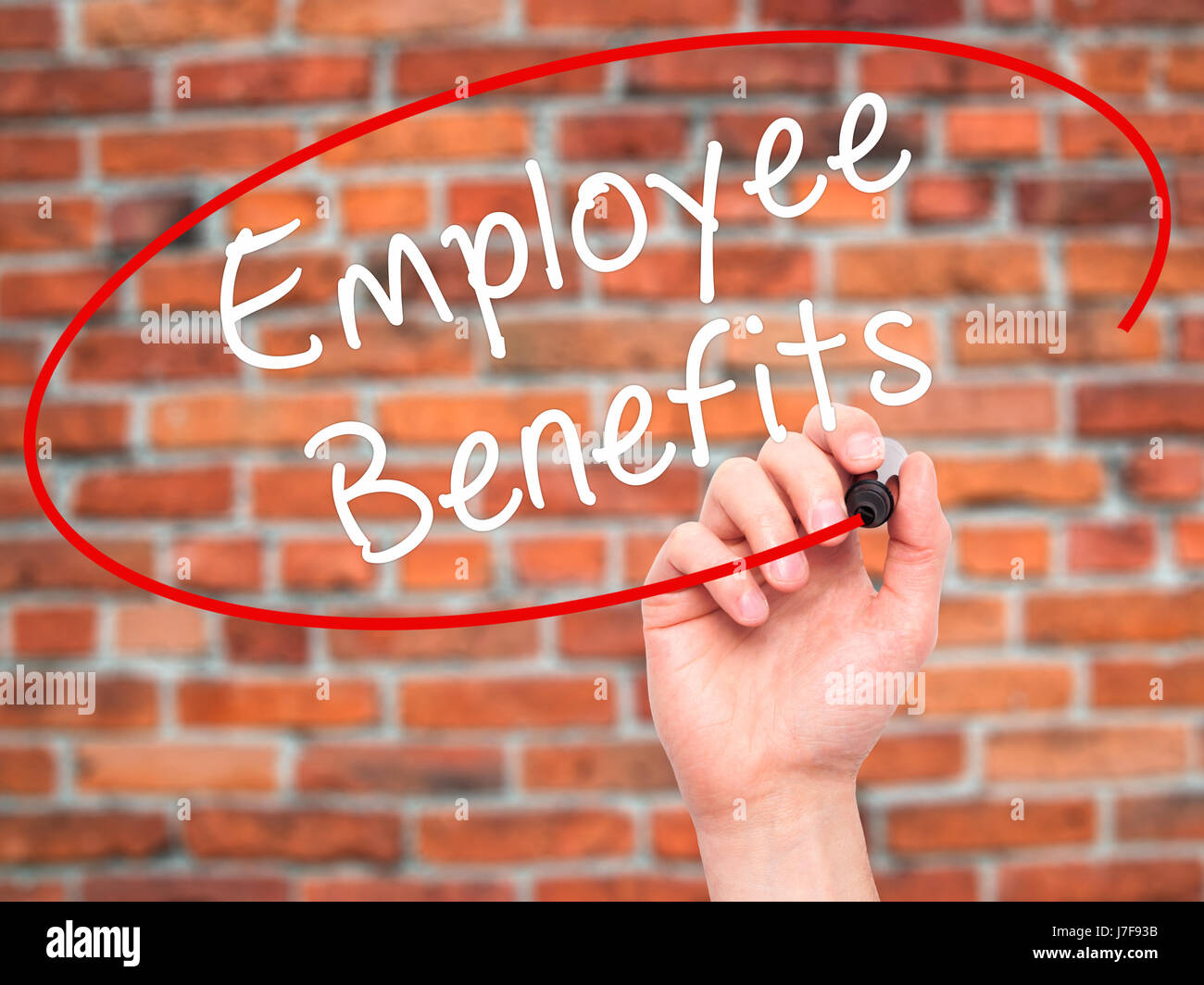 Man Hand writing Employee Benefits with black marker on visual screen ...