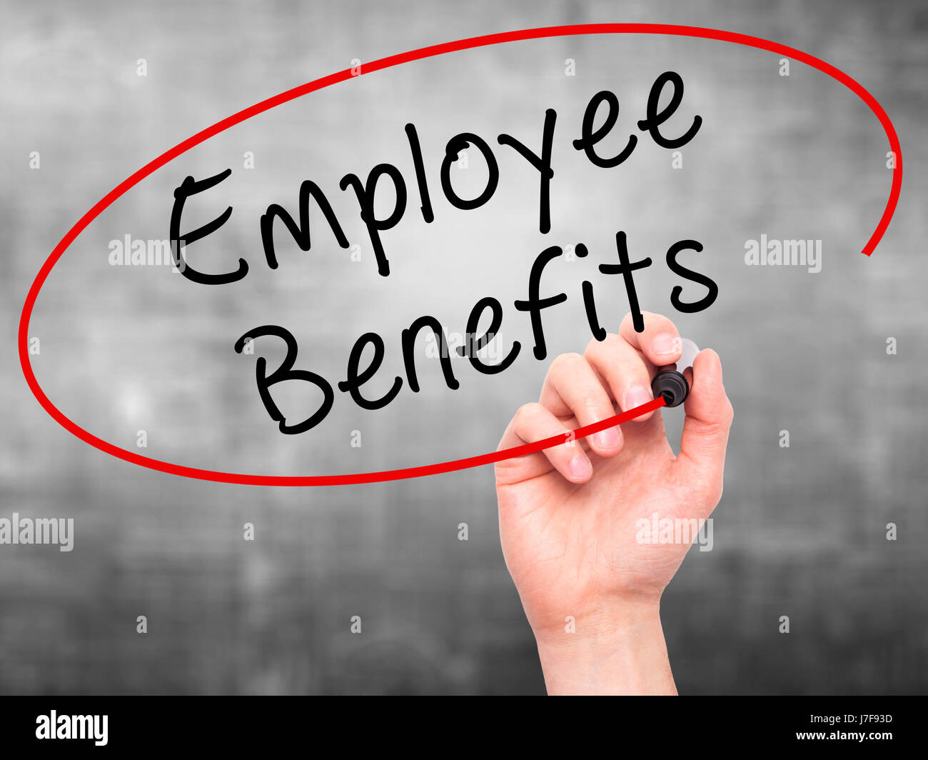 Man Hand writing Employee Benefits with black marker on visual screen ...