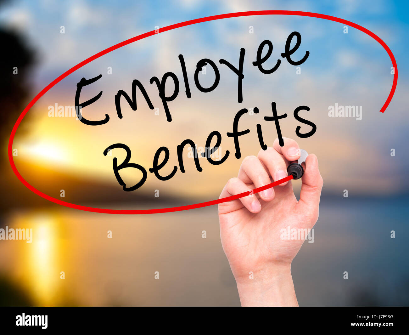 Man Hand writing Employee Benefits with black marker on visual screen ...
