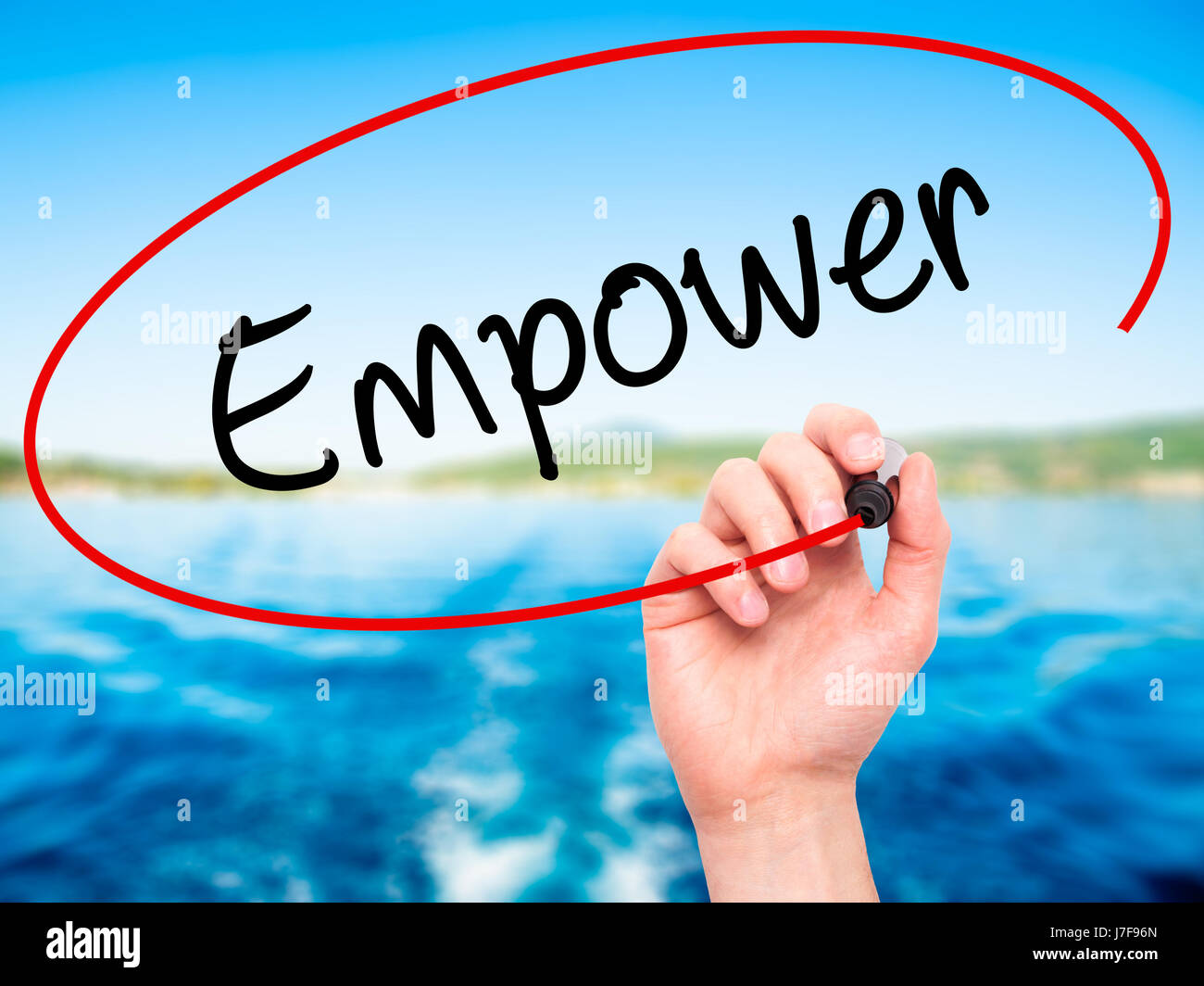Man Hand writing Empower with black marker on visual screen. Isolated ...