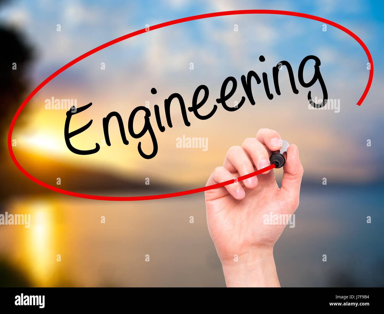 Man Hand writing Engineering with black marker on visual screen ...