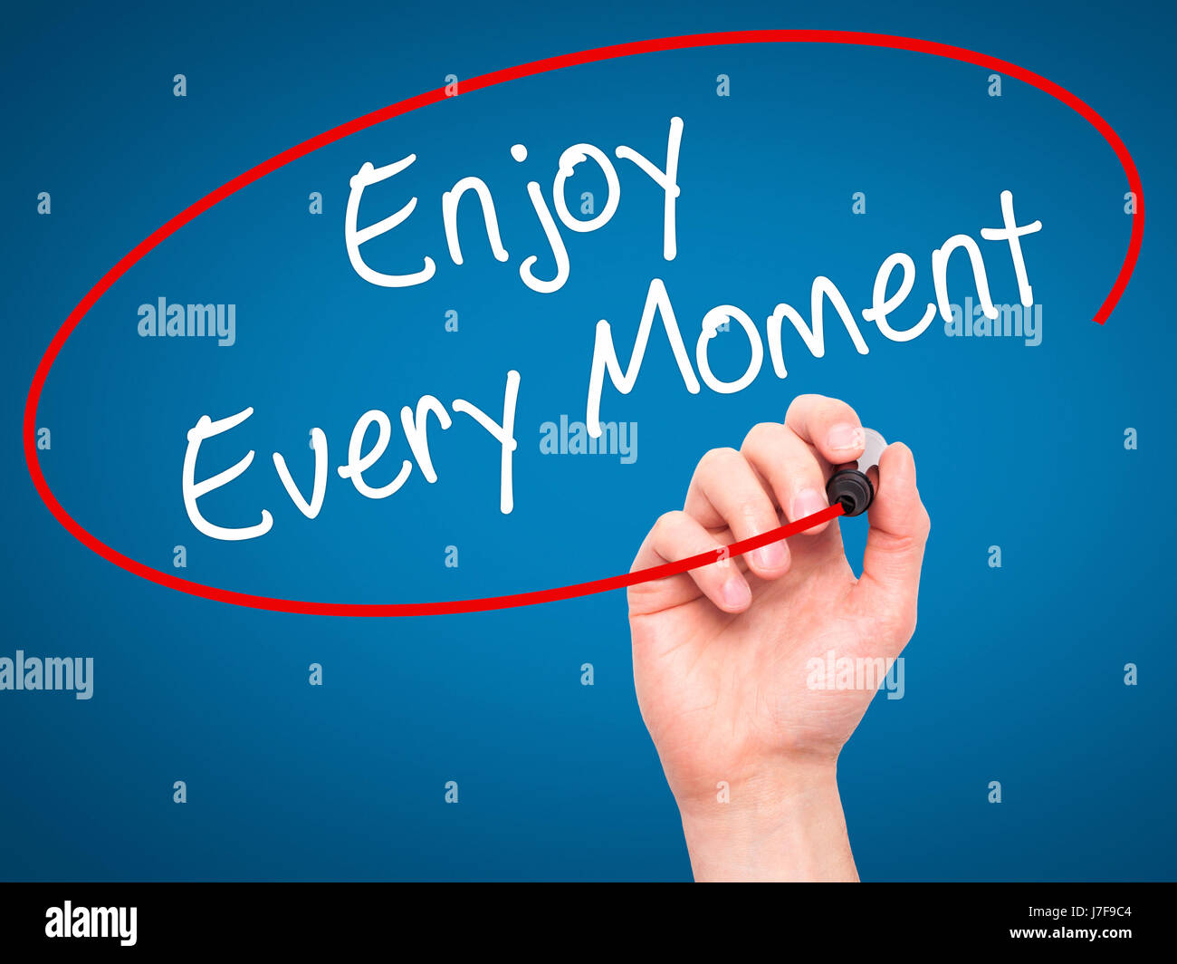 Man Hand writing Enjoy Every Moment with black marker on visual screen ...