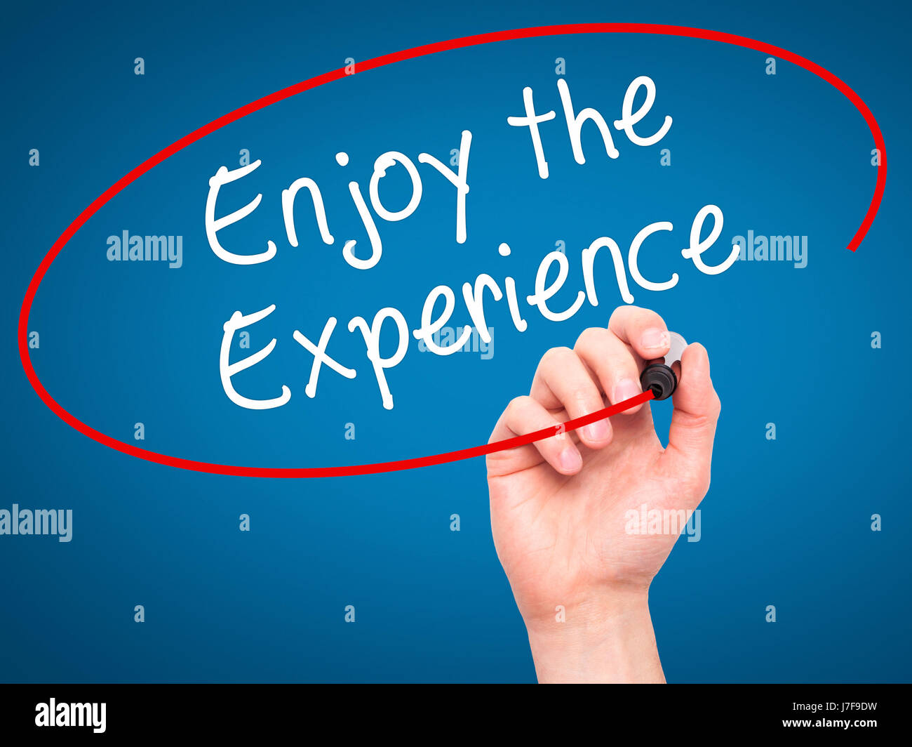 Man Hand writing Enjoy the Experience with black marker on visual ...