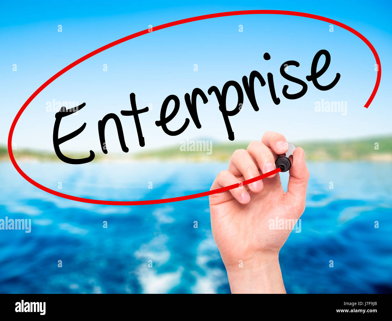 Man Hand writing Enterprise with black marker on visual screen ...