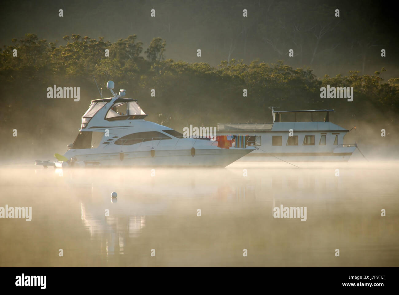 speedboat and houseboat Stock Photo - Alamy