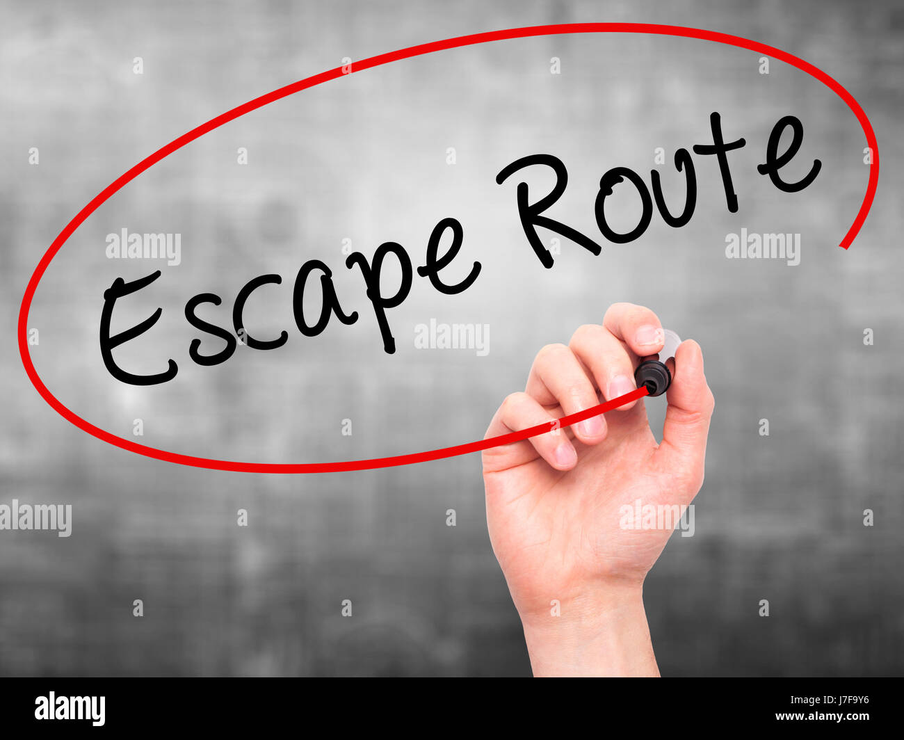 Man Hand writing Escape Route with black marker on visual screen ...