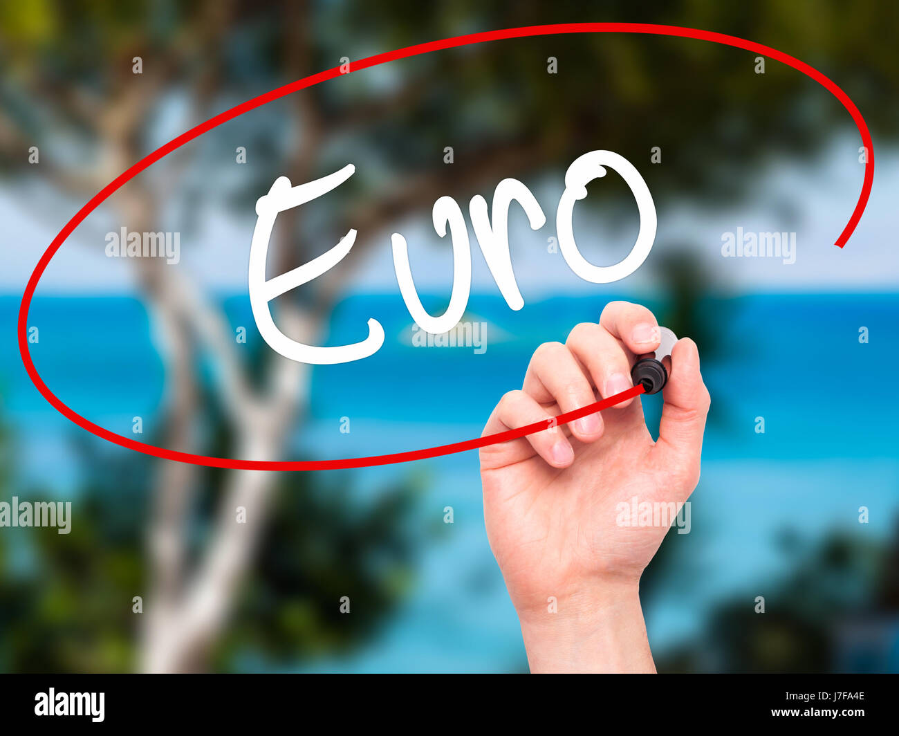 Man Hand writing Euro with black marker on visual screen. Isolated on ...