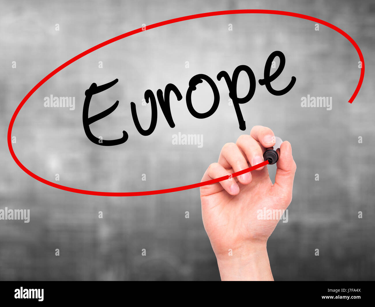 Man Hand writing Europe with black marker on visual screen. Isolated on ...