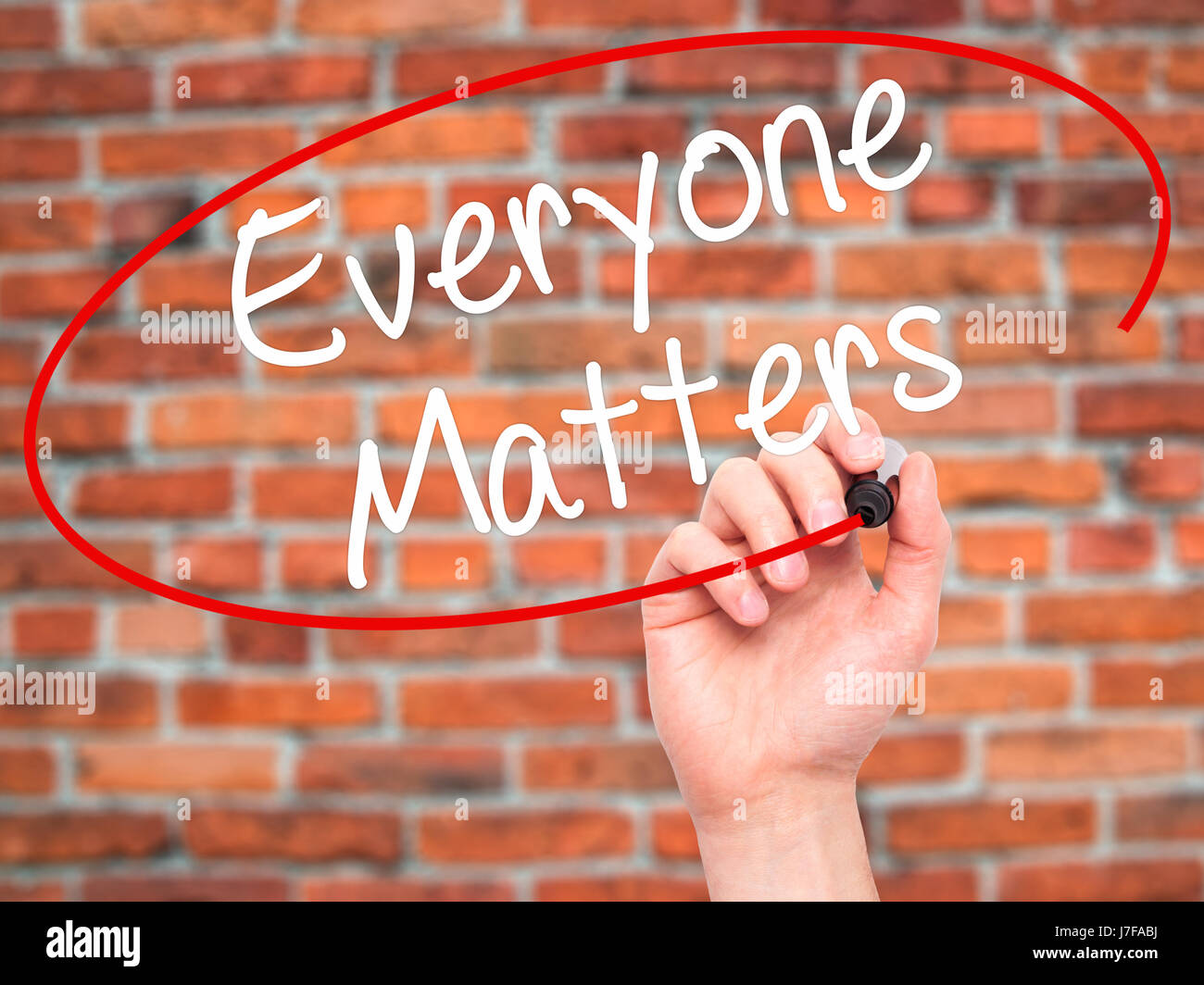 Man Hand writing Everyone Matters with black marker on visual screen ...