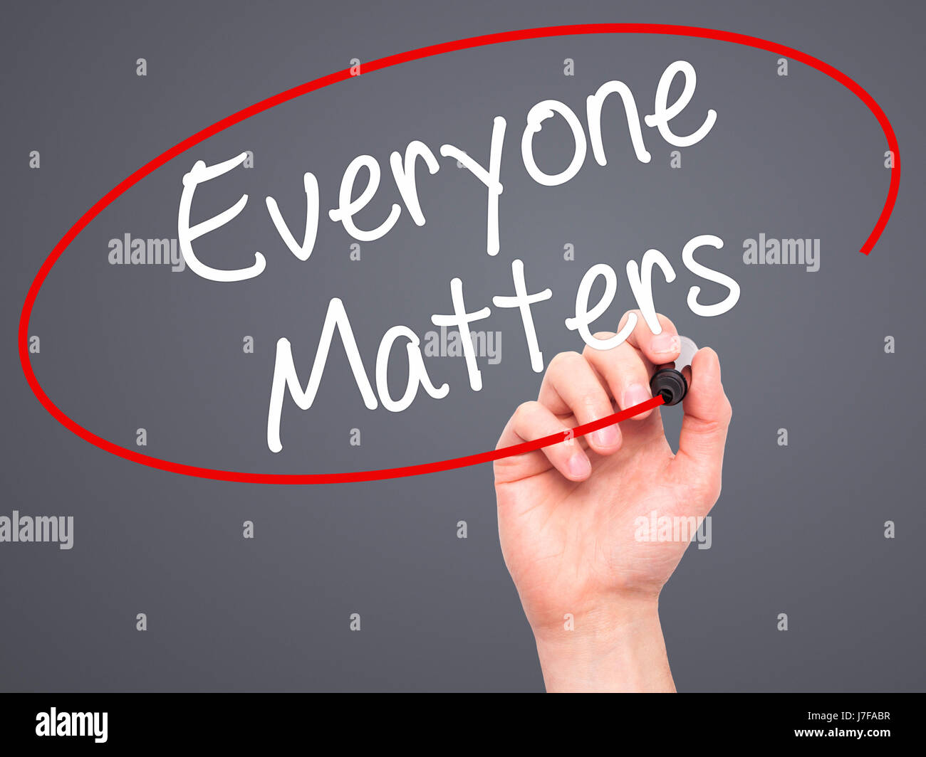 Man Hand writing Everyone Matters with black marker on visual screen ...