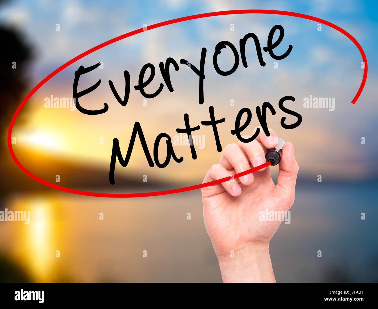 Man Hand writing Everyone Matters with black marker on visual screen ...
