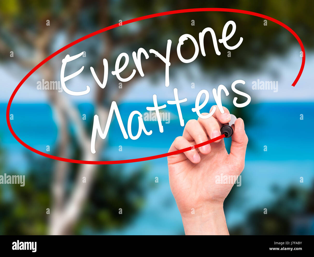 Man Hand writing Everyone Matters with black marker on visual screen ...