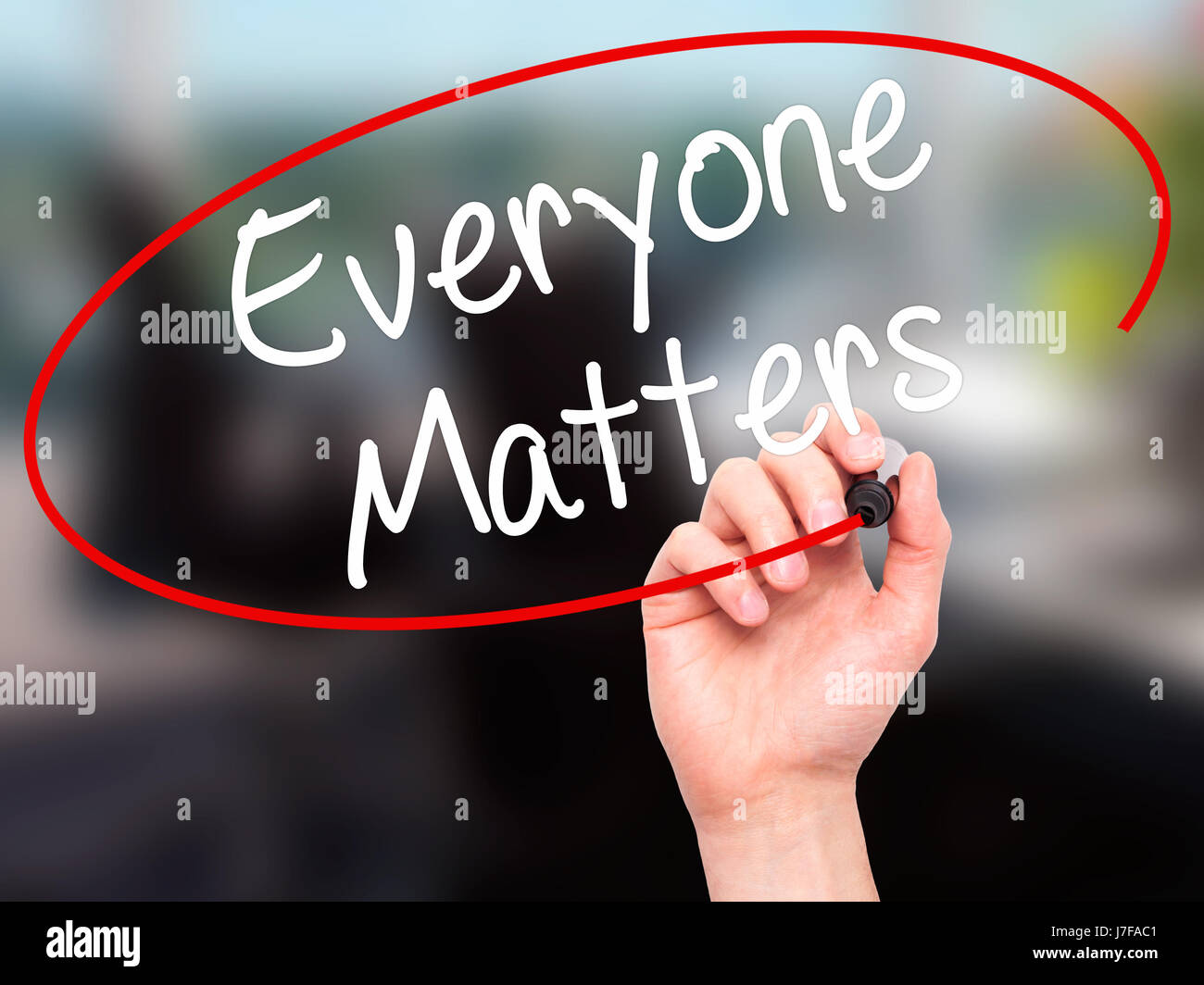 Man Hand writing Everyone Matters with black marker on visual screen ...
