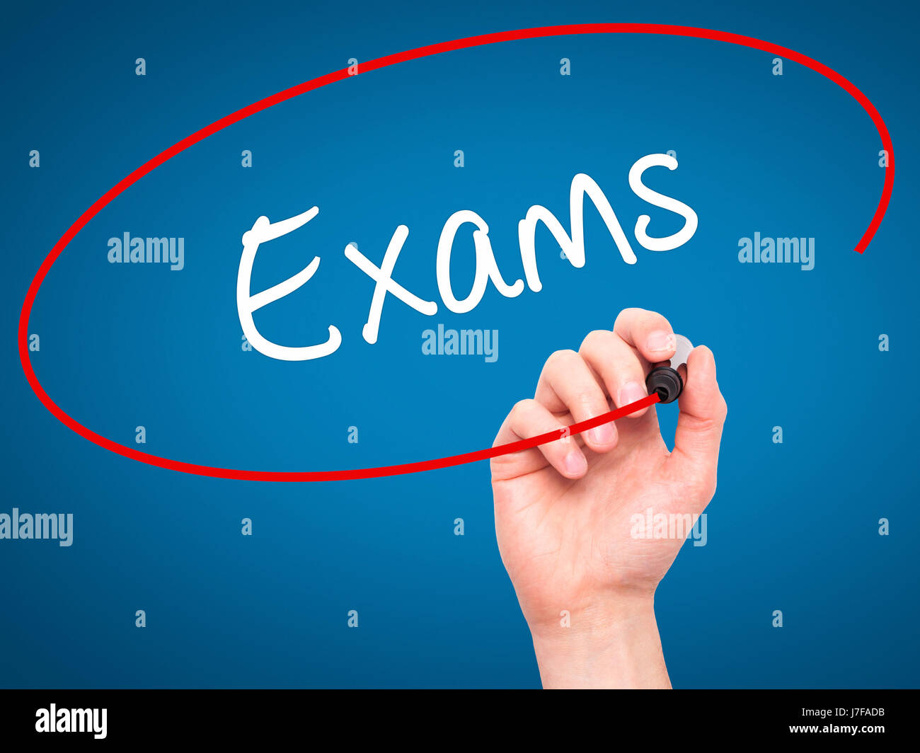 Man Hand writing Exams with black marker on visual screen. Isolated on ...