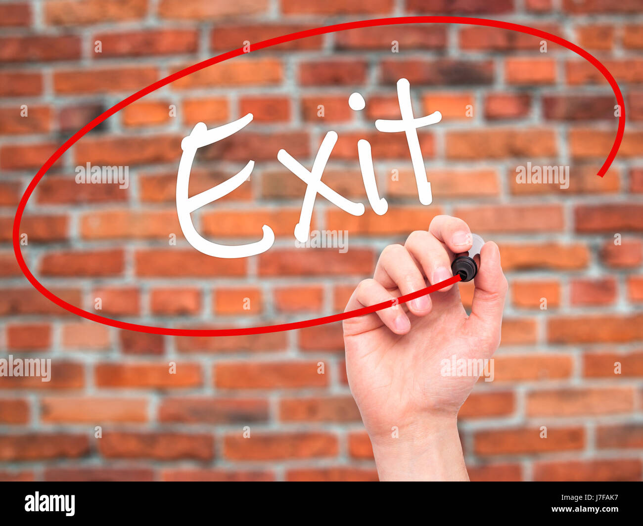 Man Hand writing Exit with black marker on visual screen. Isolated on ...